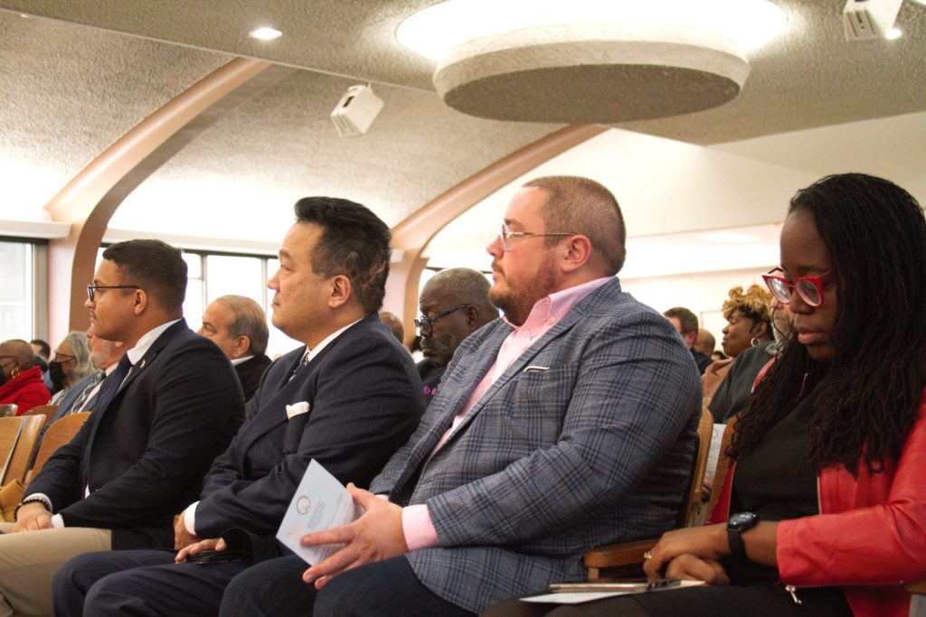 Neeley admin front row | East Village Magazine